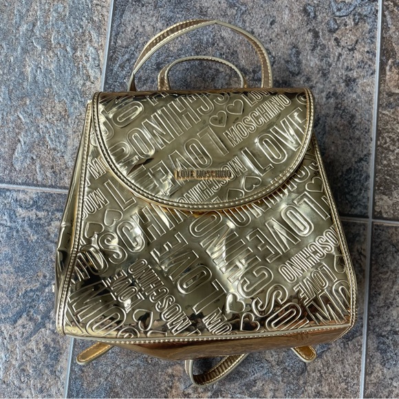 Love Moschino | Bags | Love Moschino Convertible Backpack Shiny Gold ...